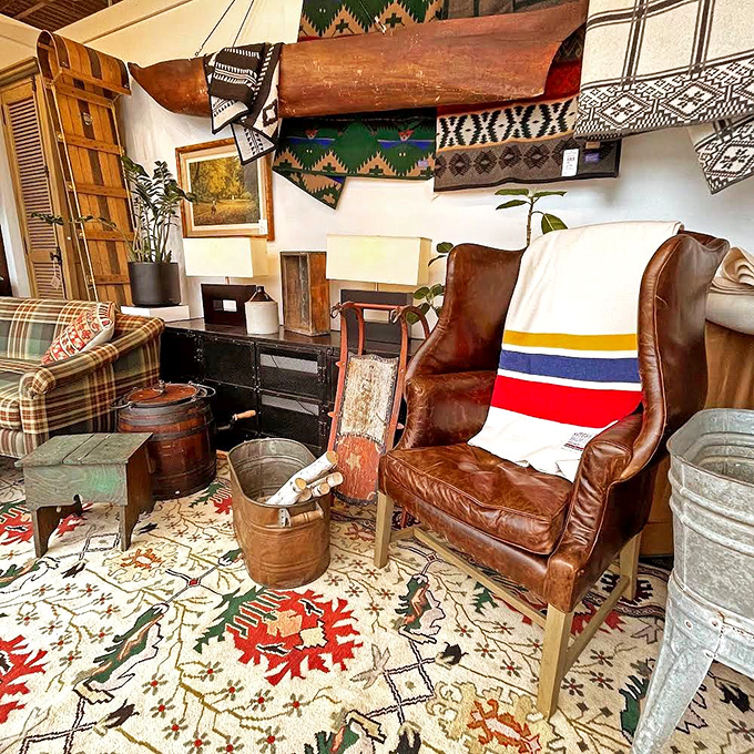 Rustic meets refined in this cozy corner where that leather wingback chair has definitely heard some stories worth telling.