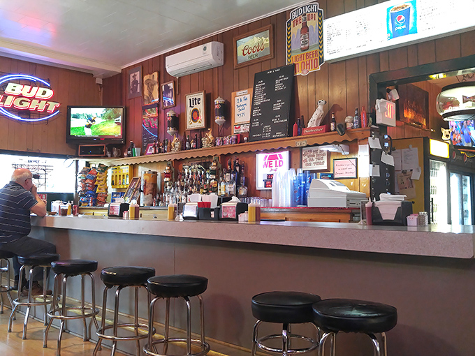 Bar seating offers front-row views of the action—where cold beers are poured and locals exchange the kind of banter that's been perfected over decades.