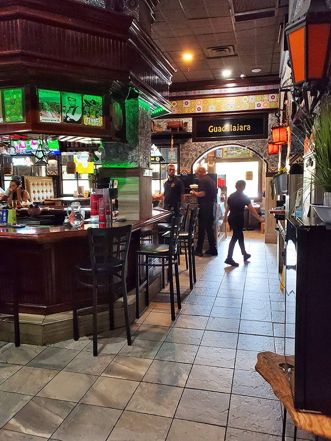Where magic happens – the bar area glows with green light, like entering a portal to Guadalajara without the airfare.