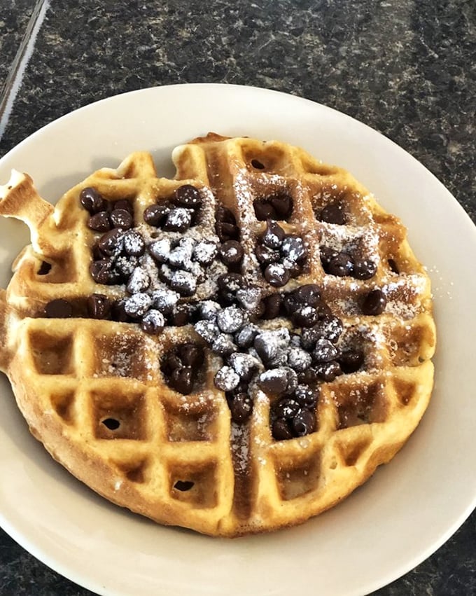 This Belgian waffle, topped with powdered sugar and blueberries, looks like it's ready for its Instagram moment—but you'll be too busy eating to post.