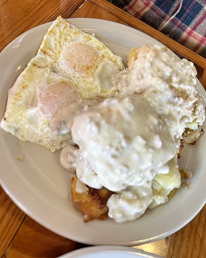 Biscuits and gravy that could settle family feuds. Those eggs are just showing off at this point, perfectly cooked and ready for their close-up.