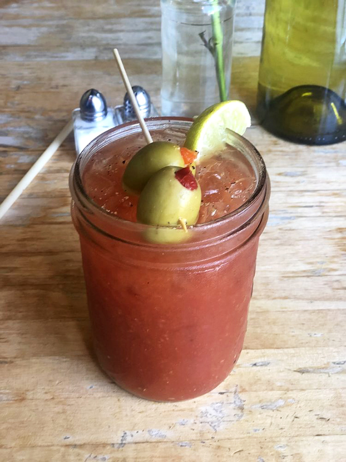 This isn't just a Bloody Mary—it's a meal in a glass, garnished with olives and a hint of spice to kickstart your weekend.