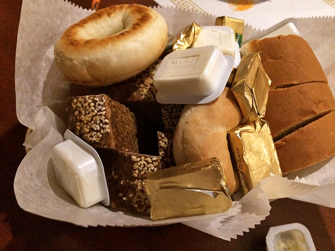 The bread basket—civilization's greatest achievement. A democracy of carbs where bagels, rolls, and sliced bread coexist in buttery harmony.