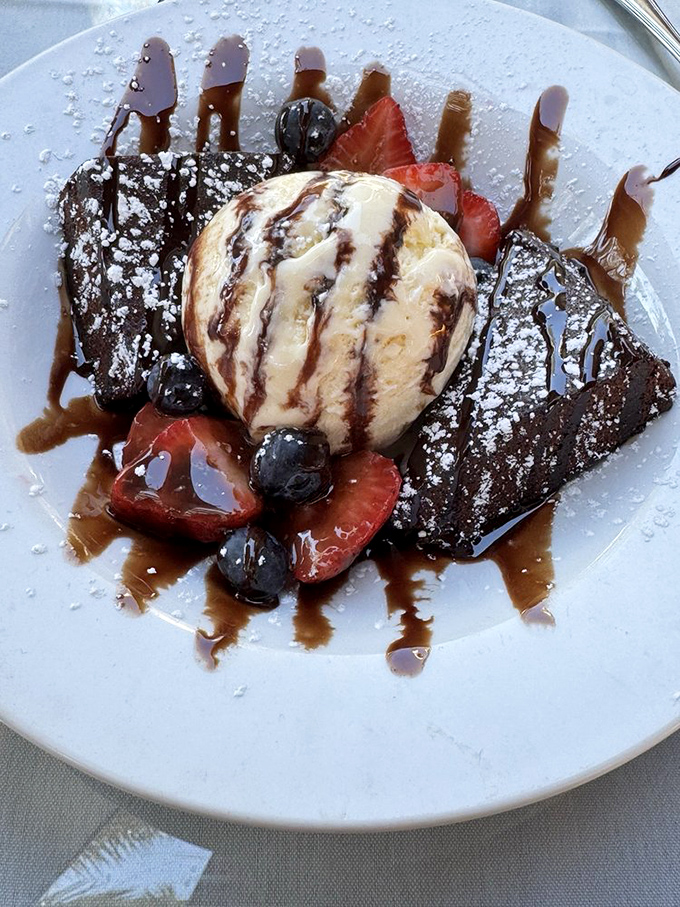 Dessert decadence featuring warm brownie, vanilla ice cream, and fresh berries. A sweet finale that would make even date shakes jealous.