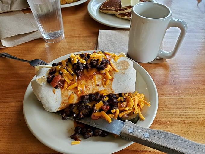 This isn't just a burrito—it's architectural genius wrapped in a flour tortilla, where beans and cheese achieve perfect harmony.