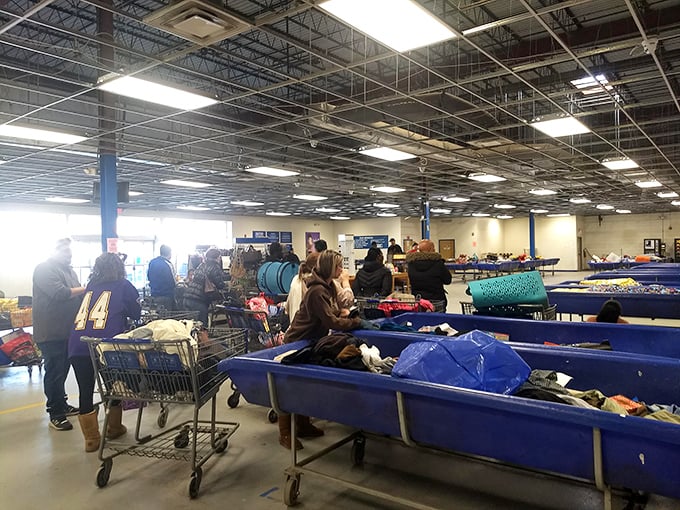The unspoken choreography of outlet shopping – carts positioned strategically, eyes scanning constantly, the universal language of the bargain hunt.