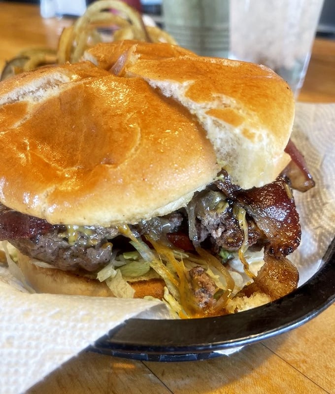 This isn't just a burger—it's structural engineering. The bacon adds both architectural support and a salty-smoky flavor boost.