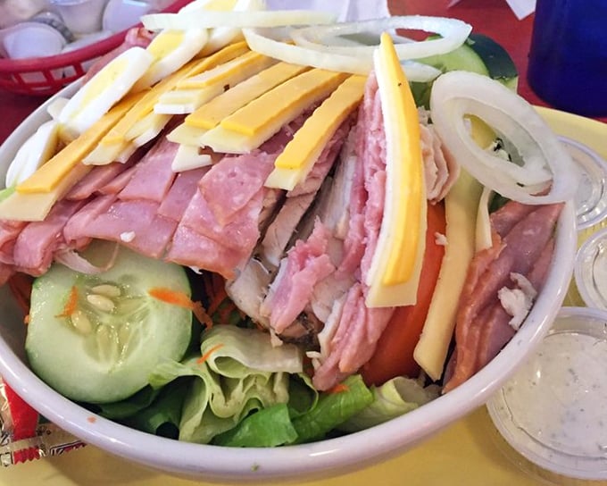 A chef's salad that's dressed to impress, with ingredients arranged like they're posing for a delicious family portrait.