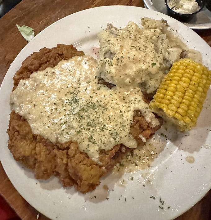 Chicken fried steak smothered in creamy gravy - comfort food that hugs your soul from the inside out.