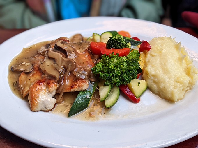 Chicken Marsala that proves mushroom sauce isn't just a topping—it's a rich, savory pool that transforms poultry into poetry on a plate.