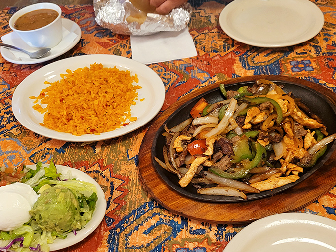 Sizzling fajitas arrive like culinary theater—the supporting cast of rice and guacamole knowing they're part of something spectacular.