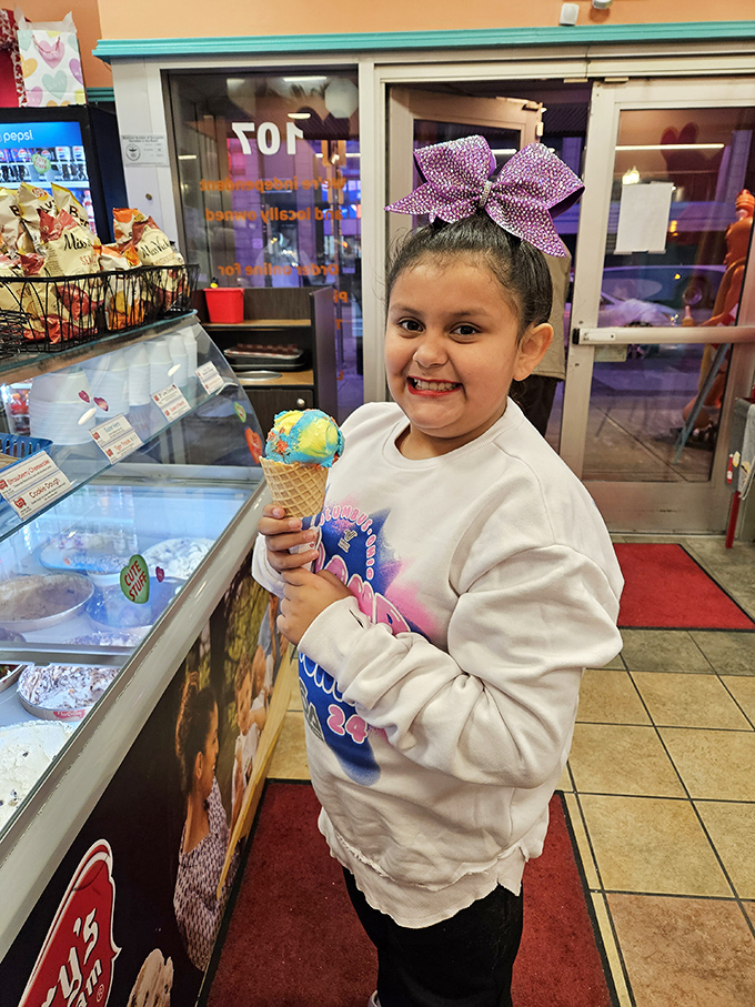The look of pure ice cream happiness—childhood distilled into a single cone of swirled delight that makes Monday feel like Saturday.