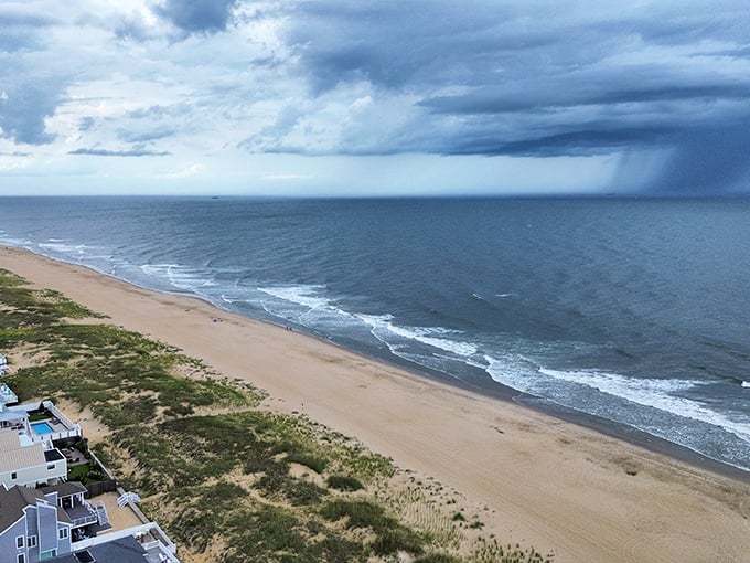 Storm clouds gathering over Sandbridge's coast create nature's drama—part threatening, part breathtaking, entirely worth watching from your covered porch.