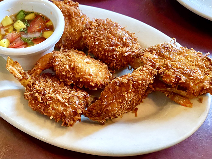 Coconut shrimp with a tropical salsa – crispy, golden treasures that bring unexpected flair to this traditional Italian menu.