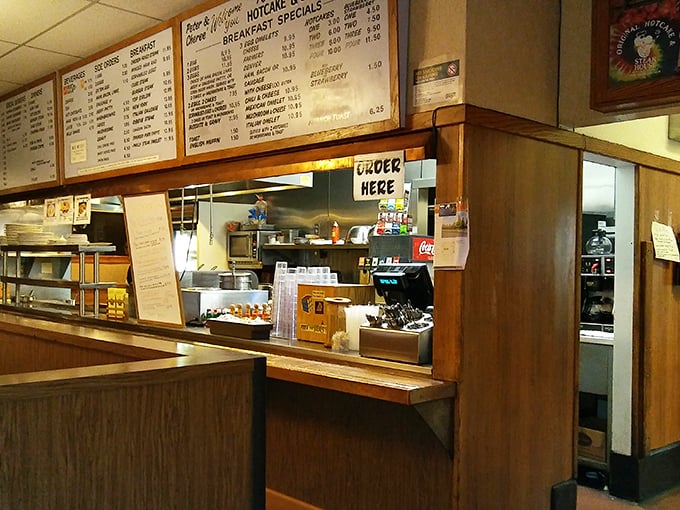 The ordering counter—where breakfast dreams begin their journey from menu board to magnificent reality.