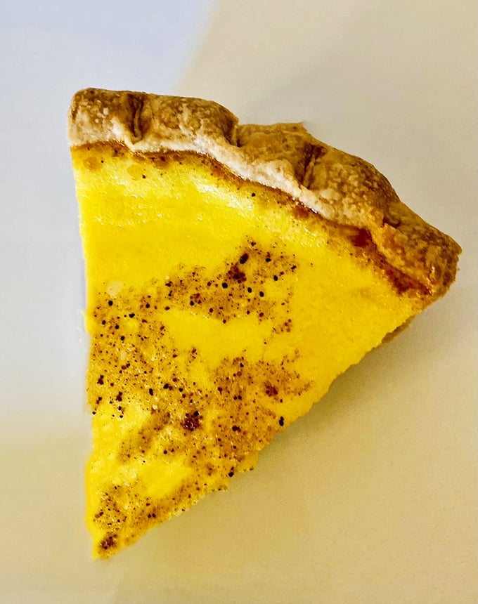 This custard pie with its delicate speckled top is the quiet achiever of the dessert world—subtle, sophisticated, and surprisingly addictive.