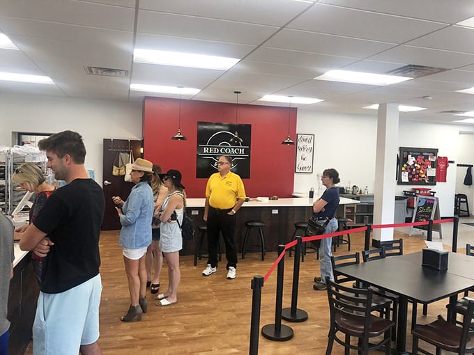 The universal language of waiting for donuts – patience rewarded with sweet treasures that justify every minute in line.