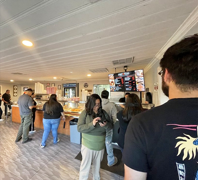 The line forms with purpose and anticipation. These patrons know that good things come to those who wait—and bring extra napkins.