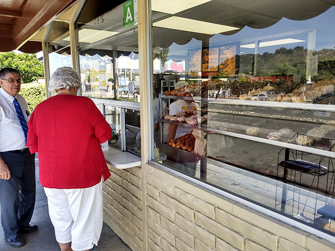 The pilgrimage to The Donut Man often involves a line, but the wait becomes part of the experience—a shared anticipation of sweetness.