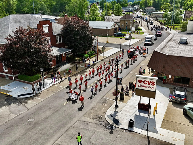 The Dennison Railroad Festival parade marches through town, a colorful reminder that community celebrations still matter in an increasingly disconnected world.