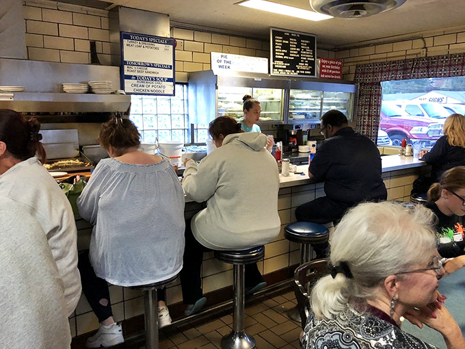 The counter where regulars become family and first-timers become regulars. Some of these stools have heard decades of Toledo stories.