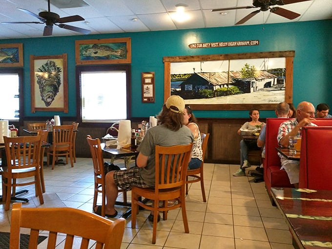 Turquoise walls adorned with fish art create the perfect backdrop for seafood feasting. This room practically whispers, "Order the catch of the day."