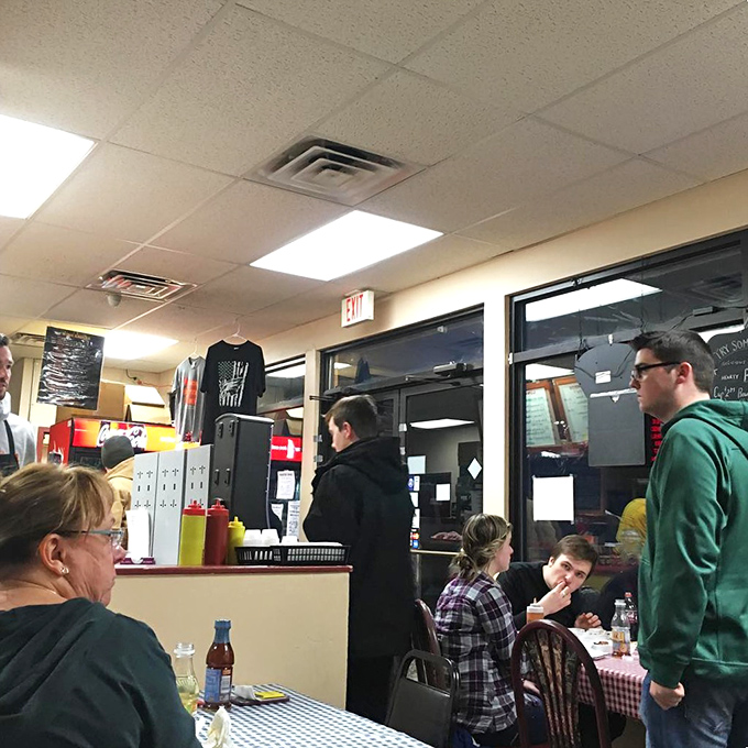 The universal language of good BBQ brings folks together. That focused expression says it all—conversation stops when the food arrives.
