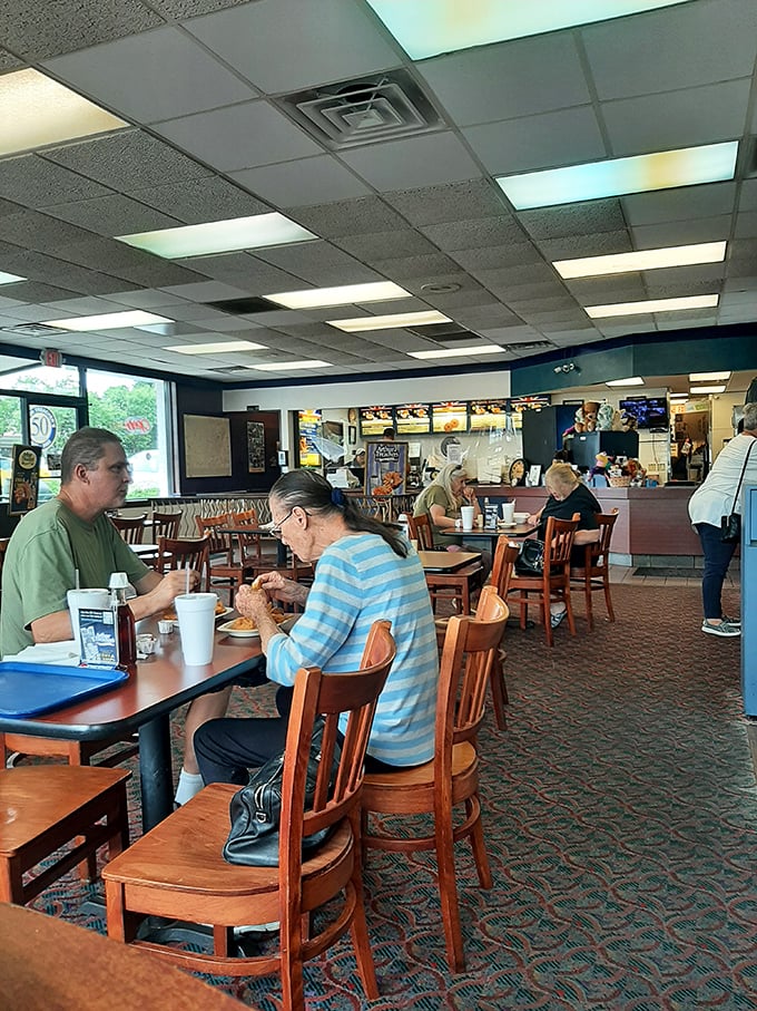 Loyal patrons enjoying their meals in comfortable familiarity. For many, this isn't just lunch—it's a pilgrimage to taste memories that span generations.