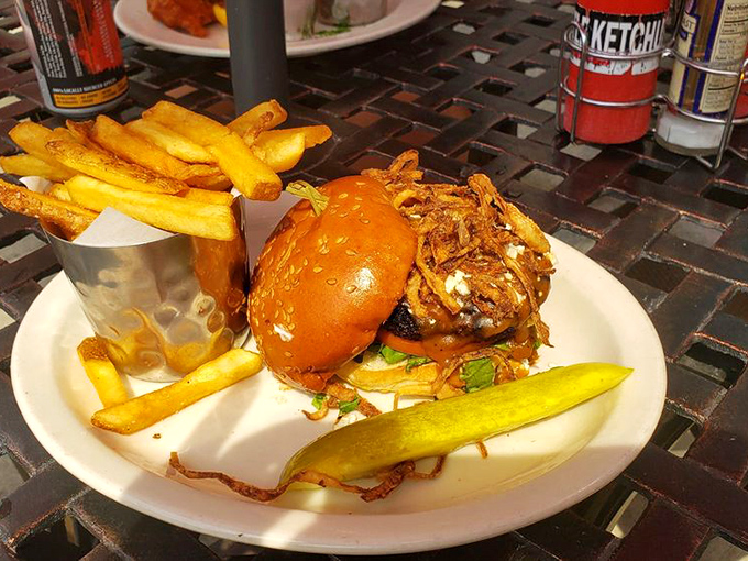 The Dublin Burger arrives like a delicious skyscraper of beef, cheese, and crispy onions – fork and knife recommended, napkins mandatory.