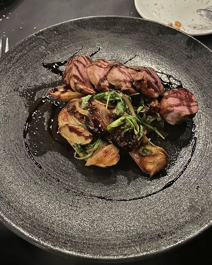 Duck breast cooked to pink perfection, sliced to showcase its rosy interior—proof that not all poultry dishes are created equal.