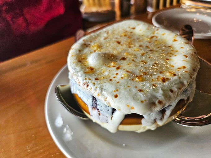 French onion soup wearing its crown of broiled cheese like a champion, waiting for you to break through to the savory treasure below.