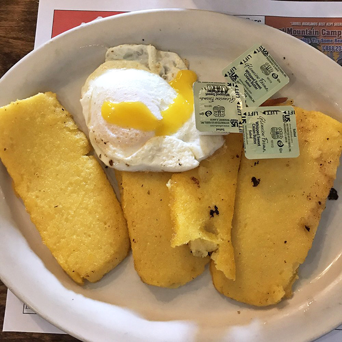 Fried corn mush with a perfectly runny egg—a Pennsylvania breakfast tradition that makes pancakes seem like they're not even trying.