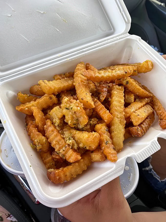 Garlic fries that don't whisper their presence—they announce it with golden, crispy authority and unapologetic flavor.
