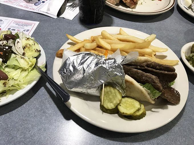 A gyro plate that doesn't need a passport to transport you. Those fries are the perfect wingmen for a sandwich adventure.