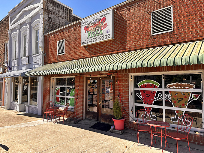 Hometown Pizza's whimsical window art promises comfort food that delivers exactly what you need after a day of small-town exploration.