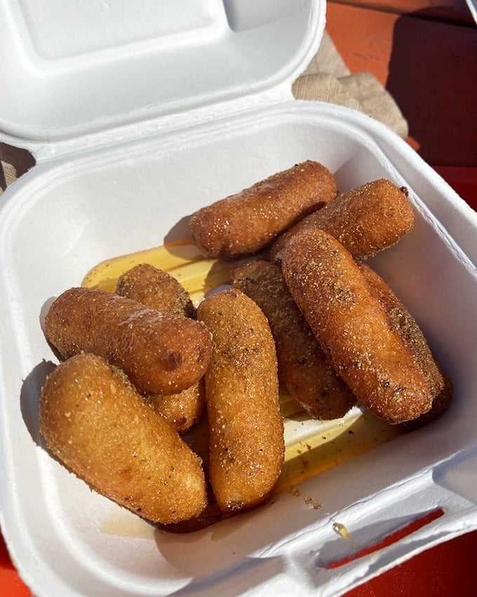 Hush puppies so perfectly golden they deserve their own spotlight. Crispy outside, tender inside—the unsung heroes of the seafood plate.