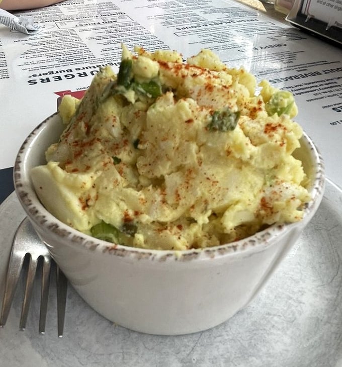 This isn't your sad grocery store potato salad—it's a creamy, homemade declaration that sides deserve the same respect as the main attraction.