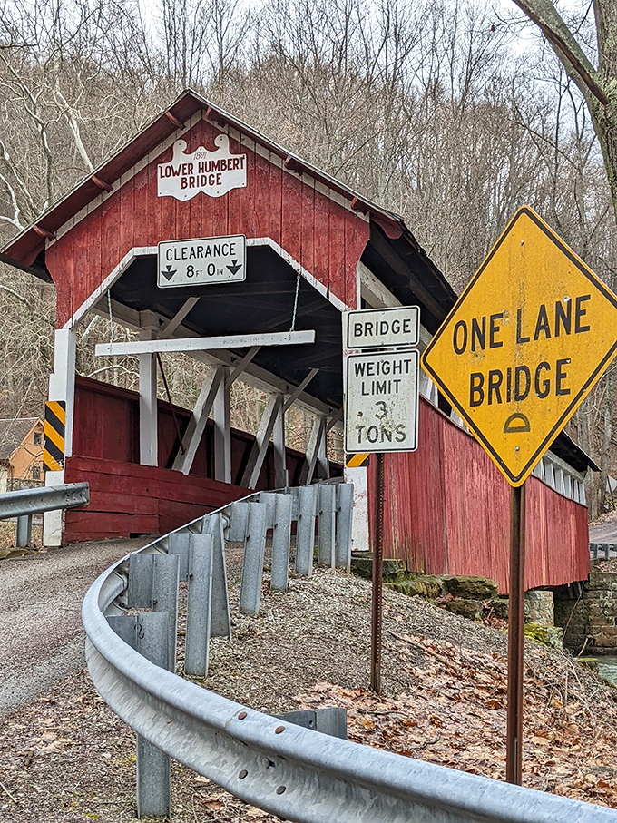 Warning signs and weight limits—the bridge's way of saying "I'm historic, not hydraulic." Respect your elders, especially the wooden ones.
