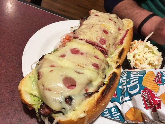 This hoagie means business—melted cheese cascading over layers of meat, a sandwich that demands both hands and your full attention.