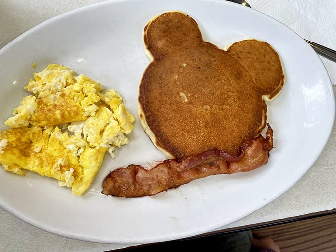 Mickey Mouse-shaped pancakes: where childhood wonder meets adult-sized hunger in a symphony of butter-soaked happiness.
