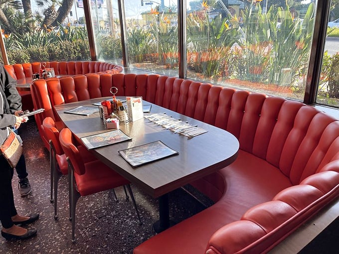 These curved booths aren't just seating—they're conversation incubators where decades of Los Angeles stories have been shared over coffee.