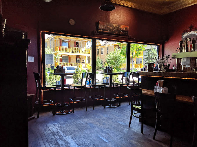 Sunlight streams through large windows, illuminating the cozy interior where Northeast Minneapolis gathers for their fish fix.