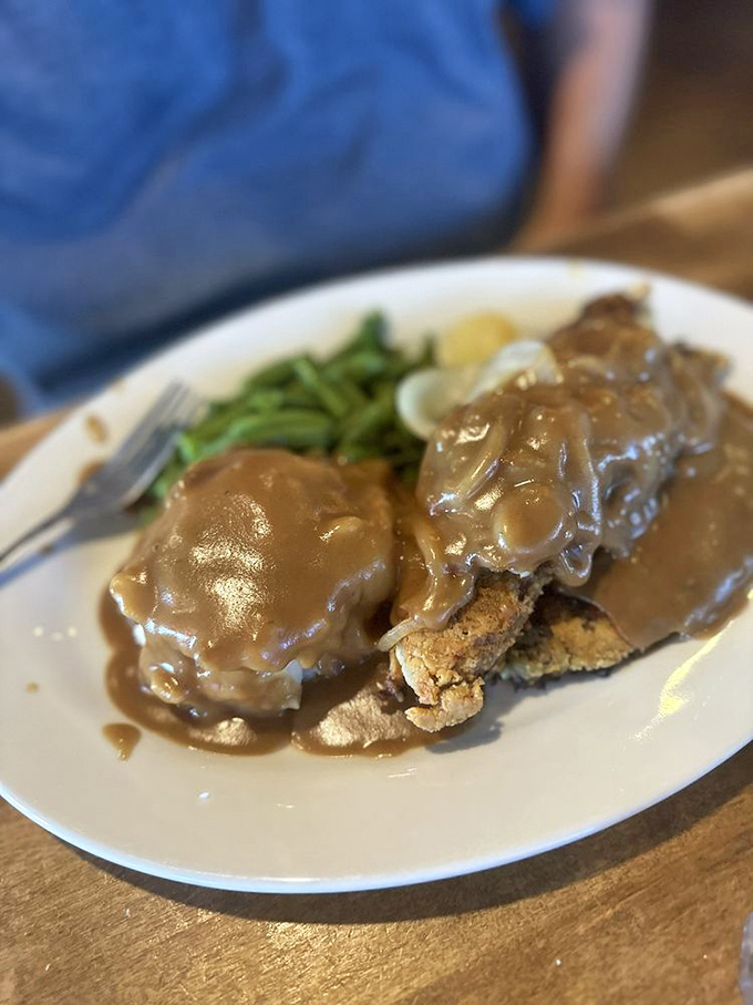 Comfort food that transports you straight to grandma's kitchen—tender meat swimming in gravy that could solve most of life's problems.