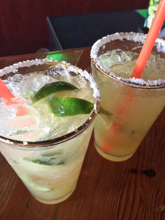 Two frosty companions adorned with tiny blue guitars—because regular garnishes are for regular drinks. These are anything but ordinary.