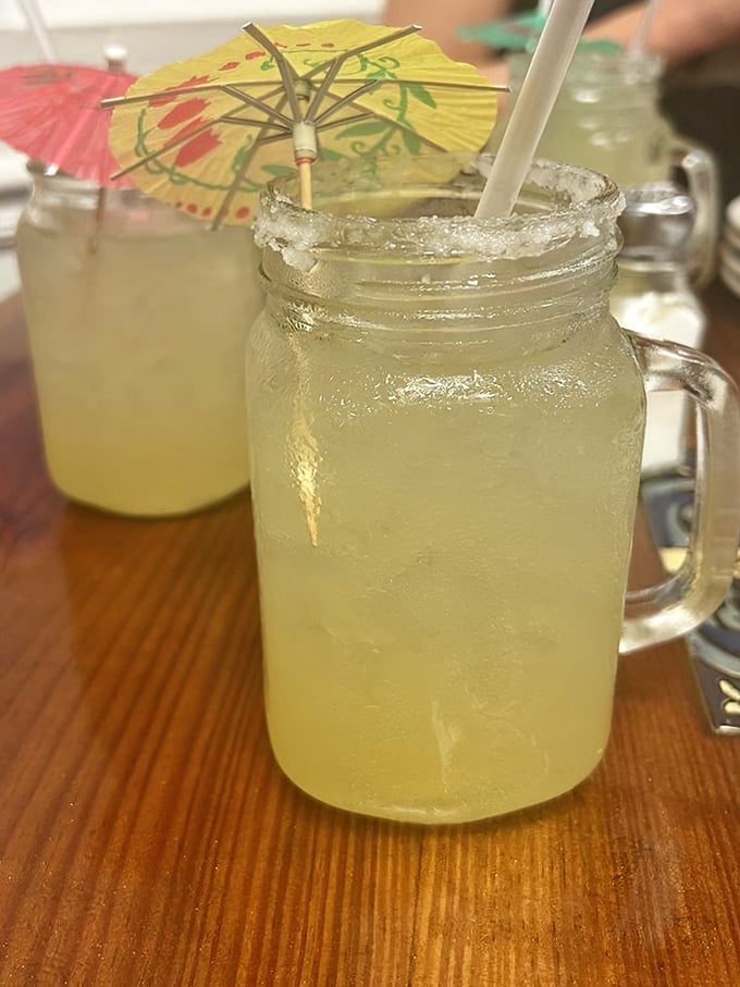 Mason jar margaritas with tiny umbrellas don't just quench thirst—they're vacation in a glass, even if you're just on lunch break.