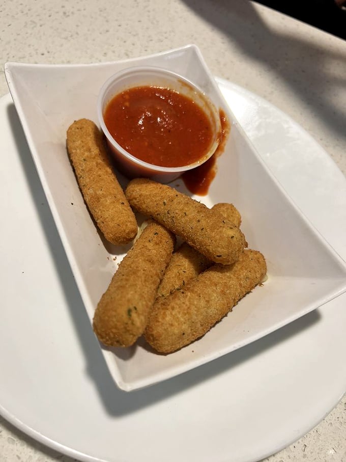 Mozzarella sticks—the diplomat of appetizers that everyone at the table can agree on. Crispy outside, stretchy inside, marinara mandatory.