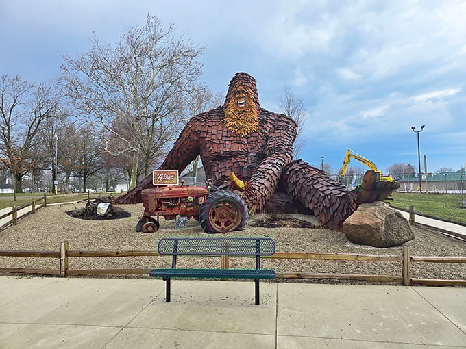 Nelson's commanding presence makes that vintage tractor look like a toy. Imagine explaining your commute delay: 'Sorry boss, Sasquatch traffic again.'