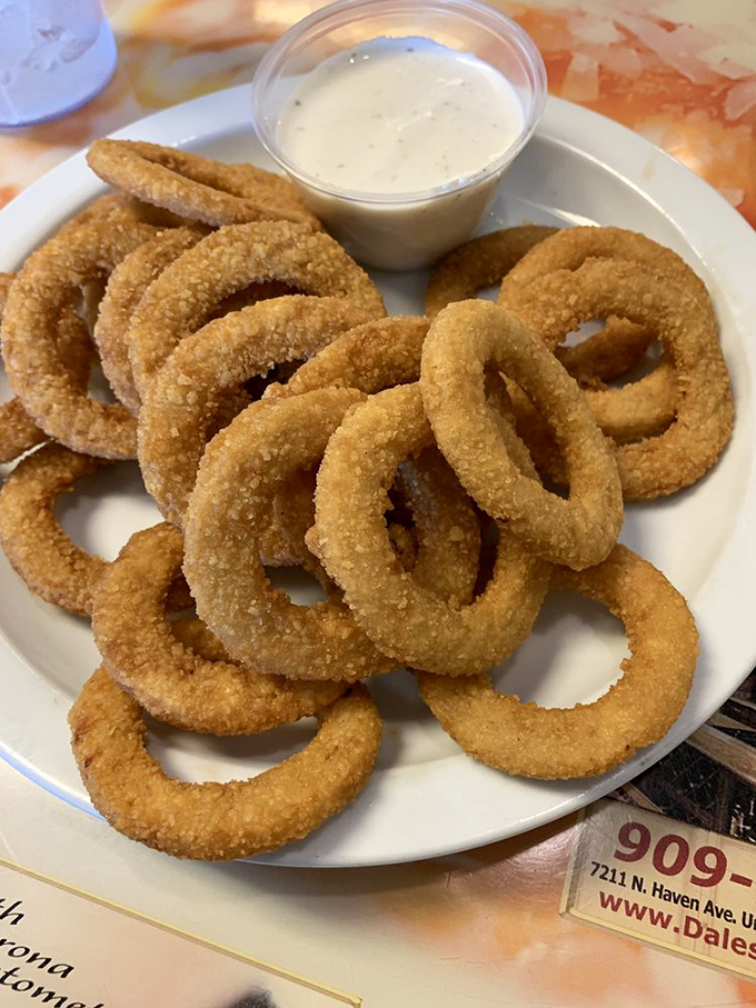 Onion rings that don't hide behind pretentious beer batters – just honest-to-goodness golden circles of joy with ranch dipping sauce.