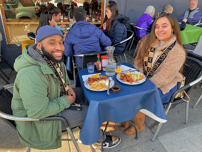 Happy diners basking in post-Benedict satisfaction – that look of contentment is the universal sign of breakfast done right.