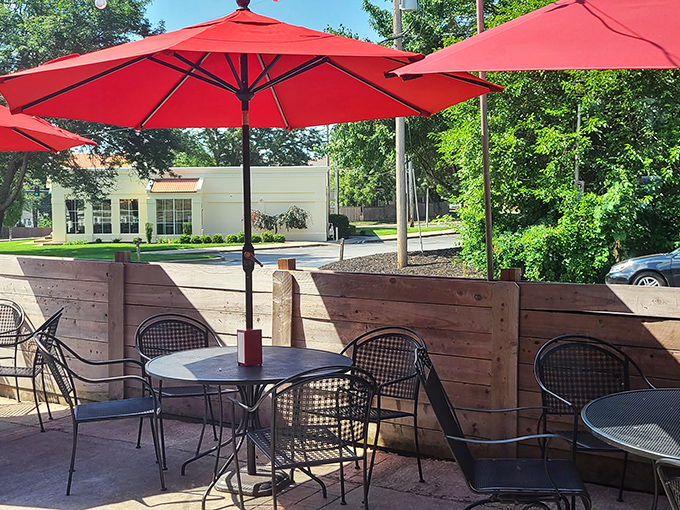 Outdoor seating that beckons on sunny Kansas days. Red umbrellas provide shade while you contemplate ordering seconds—or thirds. No judgment here.